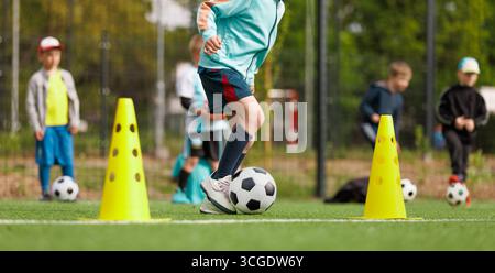 Youth Soccer Slalom Drill Training; Multiethnic Kids Practicing Ball ...