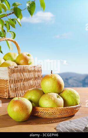 Pears in wicker basket, on bright background Stock Photo - Alamy