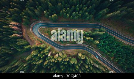 Mountain landscape showing a winding road at the foot of the mountain ...