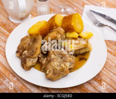 Stewed pig trotters with potato, homemade dinner Stock Photo - Alamy