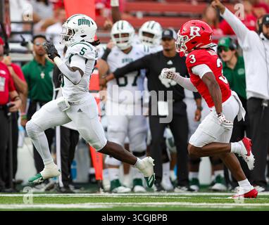 Rutgers defensive back Bo Mascoe, bottom, forces Ohio State running ...