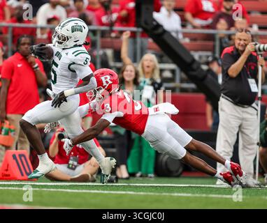 Rutgers defensive back Bo Mascoe, bottom, forces Ohio State running ...