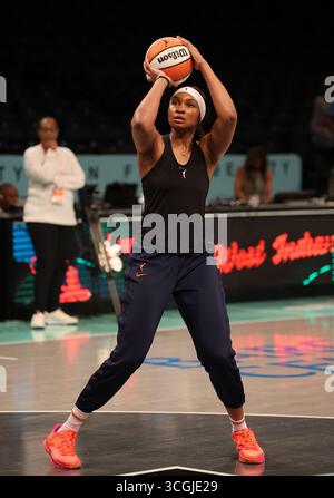 Washington Mystics forward Kiki Iriafen (44) drives in against Golden ...