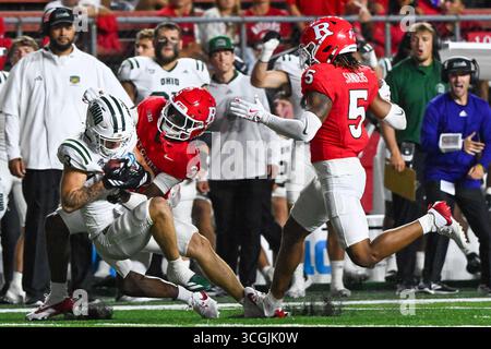 Rutgers defensive back Bo Mascoe, bottom, forces Ohio State running ...