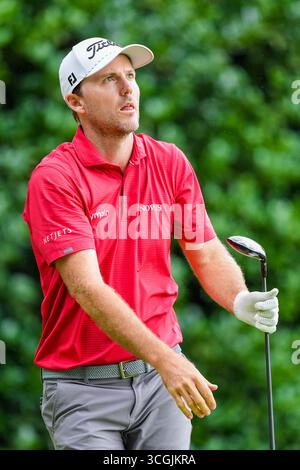 Russell Henley watches his tee shot on the 12th hole during the first ...