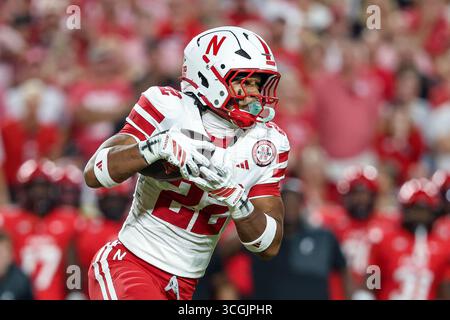 Nebraska running back Isaiah Mozee (22) carries the ball on a kickoff ...