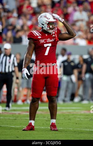 North Carolina State's Justin Joly (7) stretches for the ball with Virginia's Devin Neal (27 ...