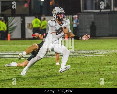 Central Florida quarterback Tayven Jackson (2) is helped off the field ...