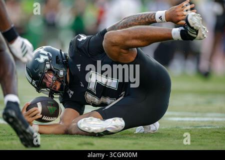 South Florida quarterback Byrum Brown (17) throws during the first half ...