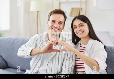 Couple sign of valentine's day on the beach Stock Photo - Alamy