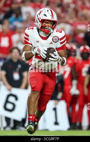 Nebraska running back Isaiah Mozee (22) carries the ball on a kickoff ...