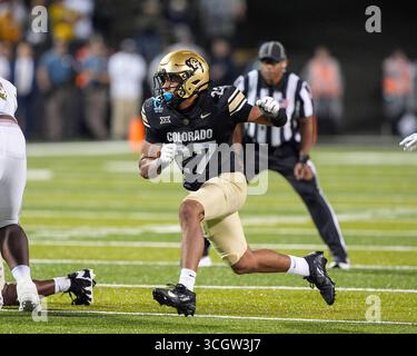 Colorado Buffaloes defensive end Derek McCartney (95), left, pulls down ...