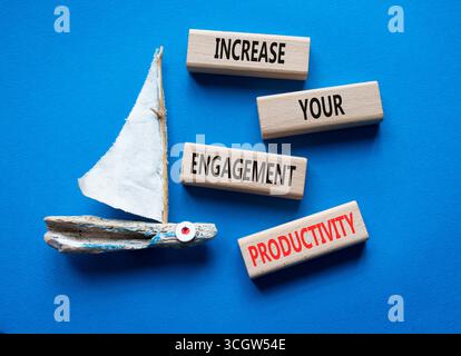 Wooden blocks with symbol of productivity concept on blue background ...
