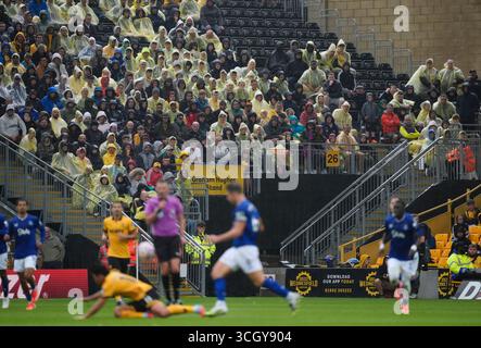 Fans wearing ponchos during the Premier League match at Molineux ...