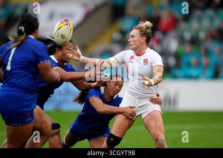 England's Megan Jones (right) is tackled during the Women's Rugby World ...