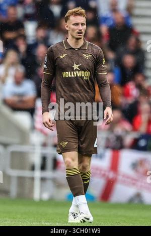 Sepp van den Berg of Brentford runs with the ball during the Premier ...