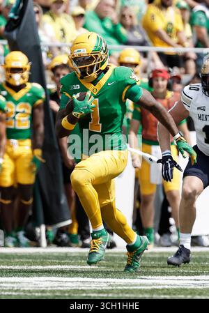 Oregon wide receiver Dakorien Moore (1) celebrates a touchdown during ...