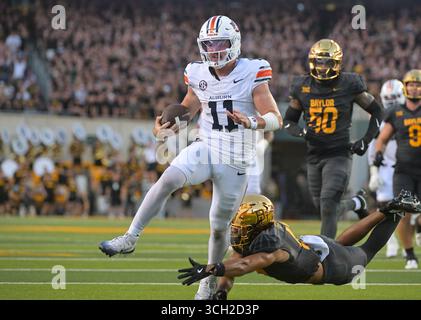Auburn quarterback Jackson Arnold (11) lays on the field after getting ...