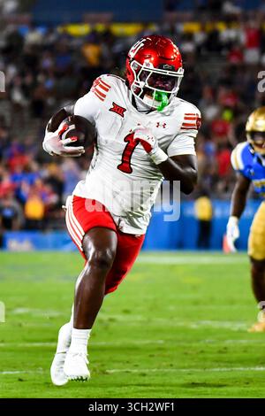 Utah running back Wayshawn Parker (1) runs with the ball as Baylor ...