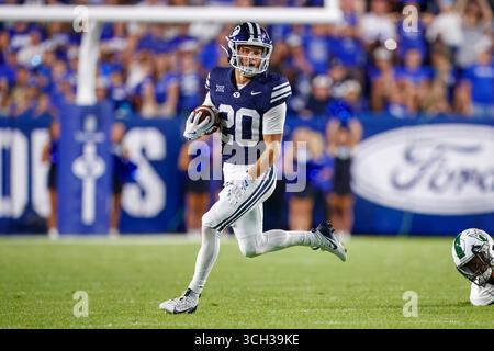 BYU tight end Carsen Ryan, front left, prepares to be hit by East ...
