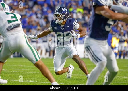BYU running back Jovesa Damuni, left, is tackled by Georgia Tech ...