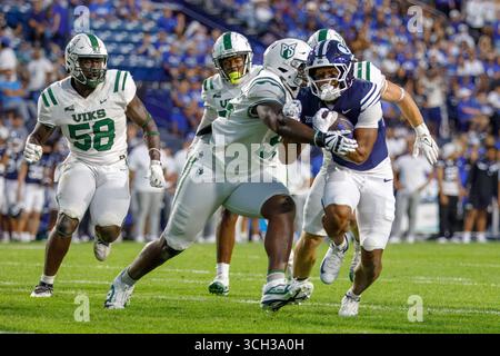 BYU running back Jovesa Damuni, left, is tackled by Georgia Tech ...