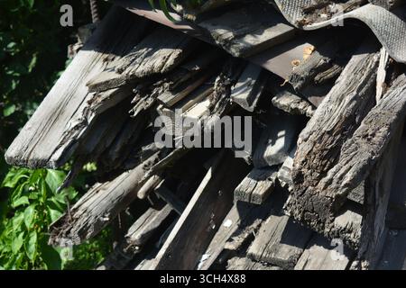 Old things and objects, old grey rotten boards of different sizes are ...