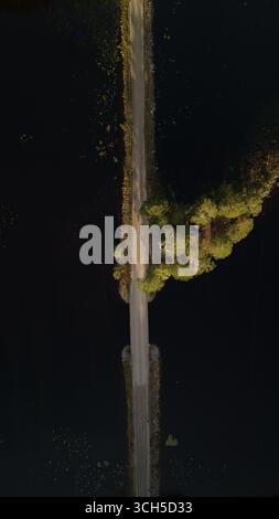 An aerial shot of a small bridge over a river in Heerenveen town ...