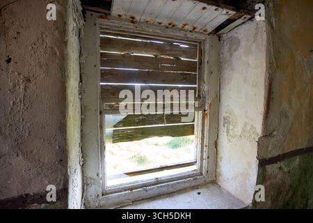 Inside of derelict abandoned old Irish cottage near Fair Head county ...