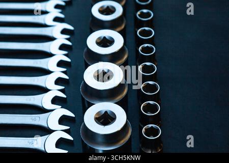 A set of wrenches and hex sockets on a black background Stock Photo - Alamy