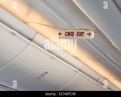 Airplane exit sign with bilingual marking. Safety, navigation, and ...