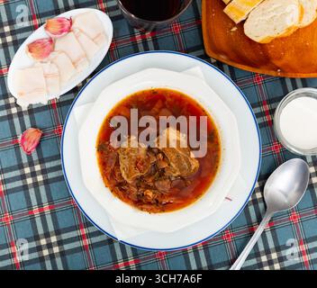 Borscht in bowl with sliced salo Stock Photo - Alamy