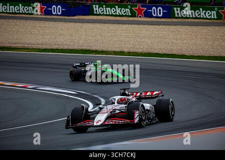 (L to R): Esteban Ocon (FRA) Haas F1 Team with Lance Stroll (CDN) Aston ...
