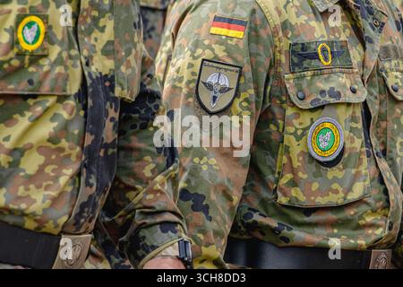 German Bundeswehr paratroopers stand in formation at a NATO event ...