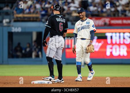 Los Angeles Dodgers shortstop Mookie Betts dives into second for a ...