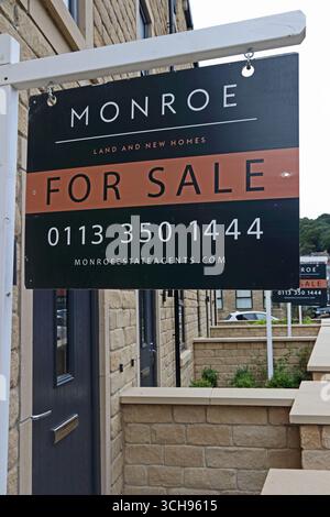 For Sale boards outside new build houses, Hebden Bridge Stock Photo - Alamy