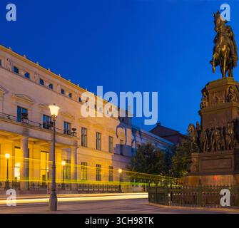 A long exposure of blue light stripes isolated on a black background ...