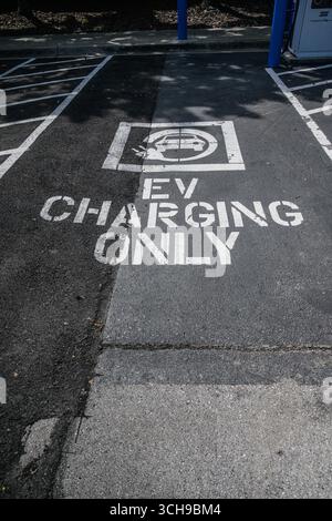 Pavement markings at an EV charging station Stock Photo - Alamy