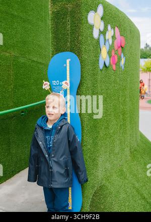 Child on background of decoration of flowers, Gurzuf, Crimea Stock ...