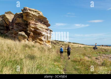 Walkers passing the Caiplie Caves - cave system known locally as The ...