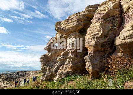 Walkers passing the Caiplie Caves - cave system known locally as The ...