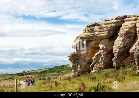 Walkers passing the Caiplie Caves - cave system known locally as The ...