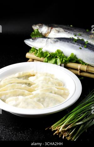 Traditional Asian dish. Crescent shape imperfect dumplings with spicy ...