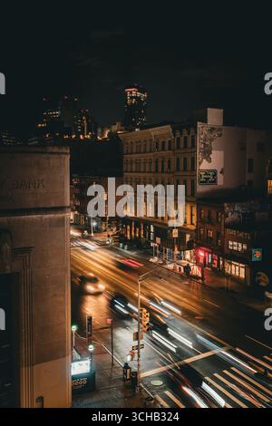 Brick storefronts with street lights at night Stock Photo - Alamy