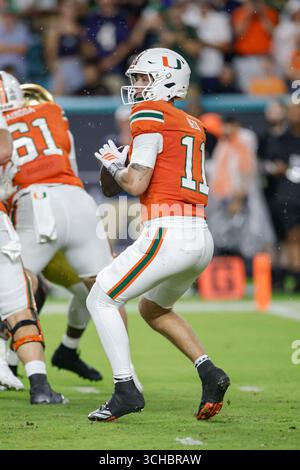 Miami quarterback Carson Beck (11) passes the football during the first ...