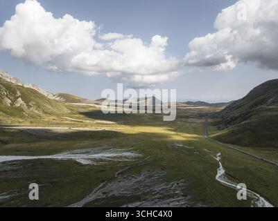 An aerial view of a vast plain with mountains in the distance Stock ...