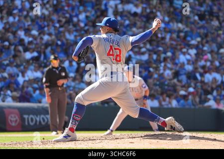 Chicago Cubs pitcher Daniel Palencia wears the large hat of mascot ...