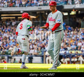 Philadelphia Phillies first base coach Paco Figueroa (38) collects ...