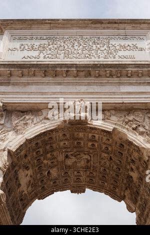 Arch of Titus, Rome, Italy, featuring detailed reliefs and Latin ...