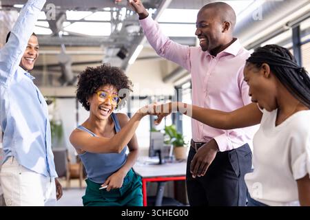 Smiling black asian enjoying victory on yellow, gambling online, mockup ...